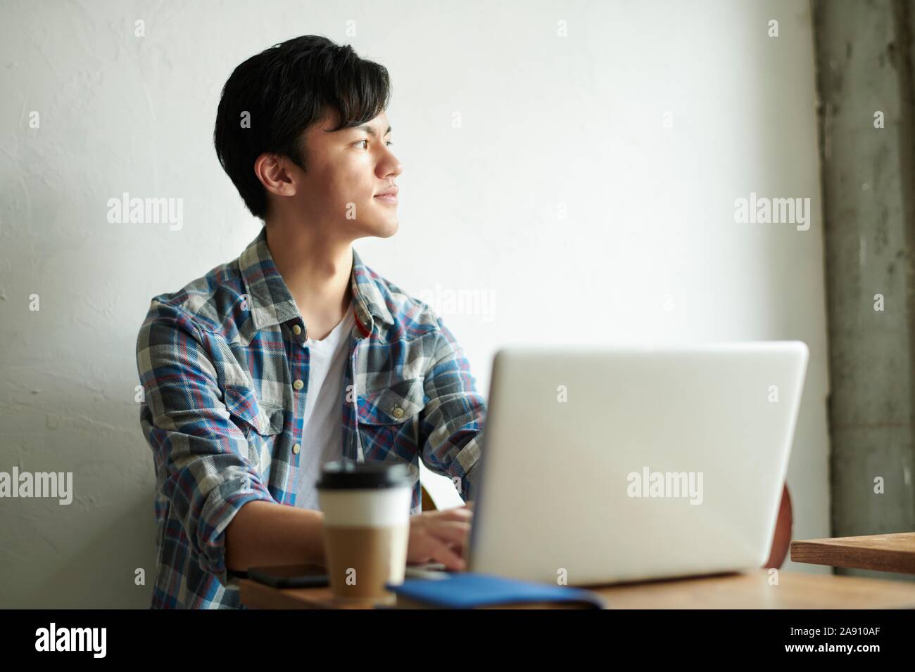 Young Japanese man at a cafe Stock Photo - Alamy