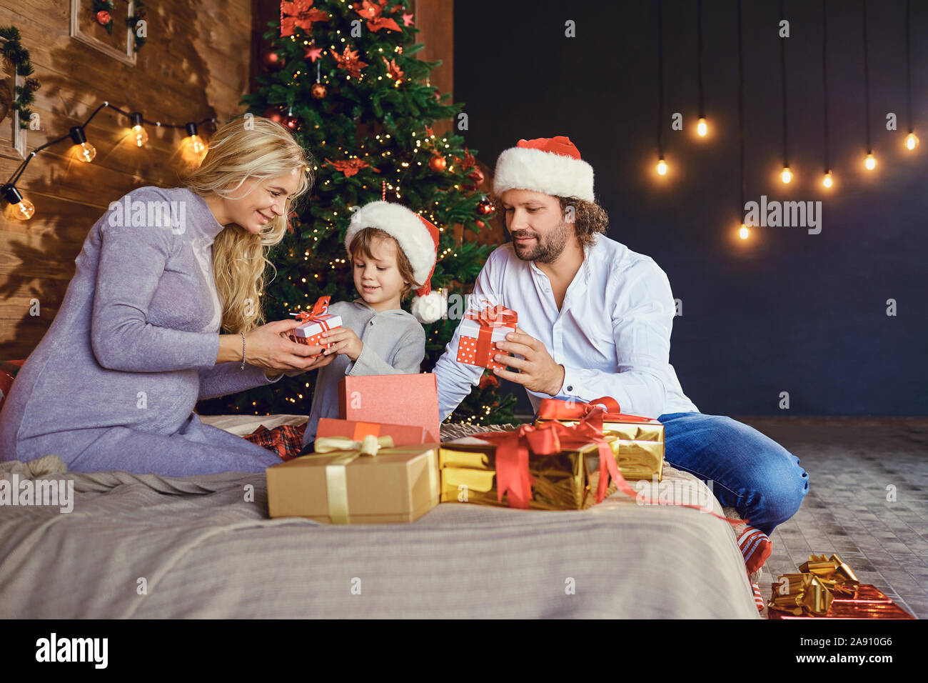 Santa giving child a gift hi-res stock photography and images - Alamy