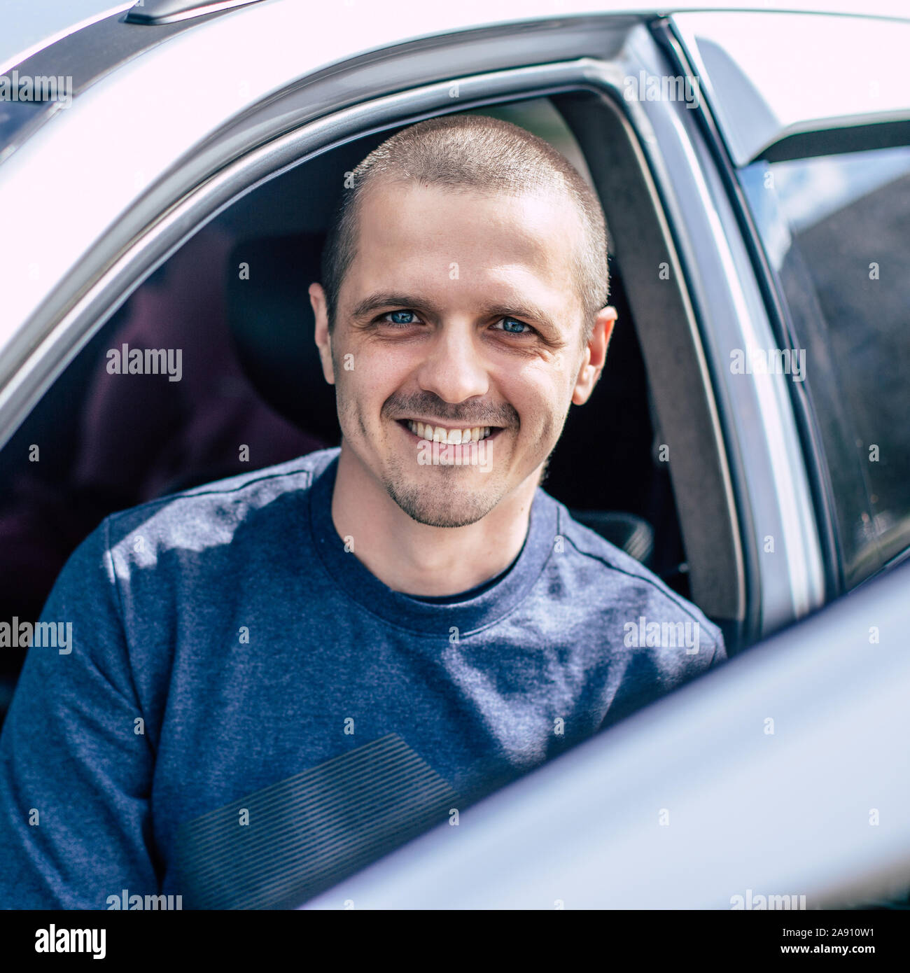 Smiling man looking camera through hi-res stock photography and images ...