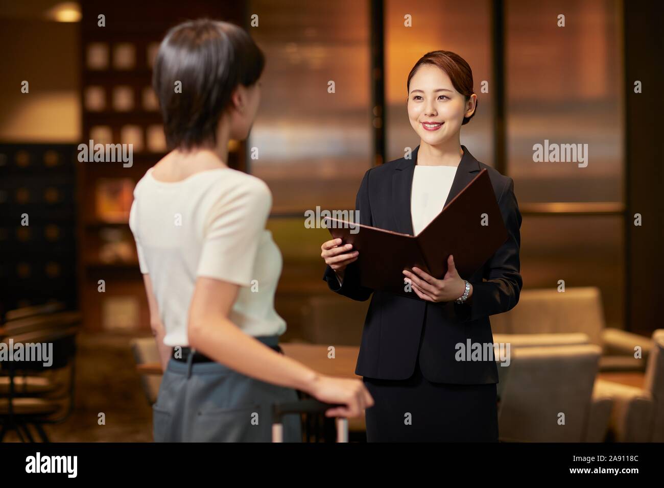 Asian woman hotel concierge hi-res stock photography and images - Alamy
