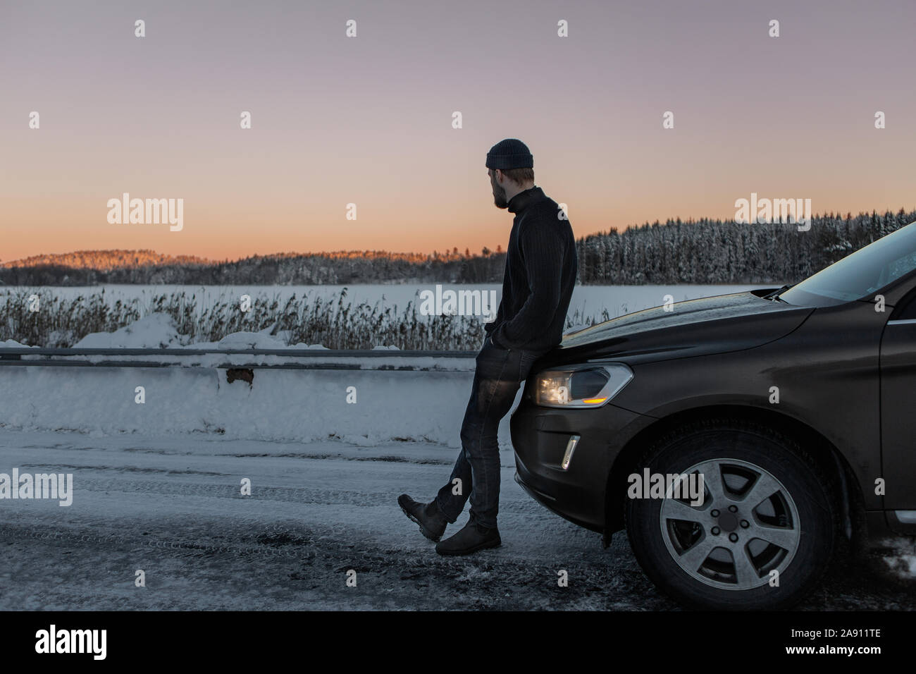 Man standing in front of car Stock Photo - Alamy