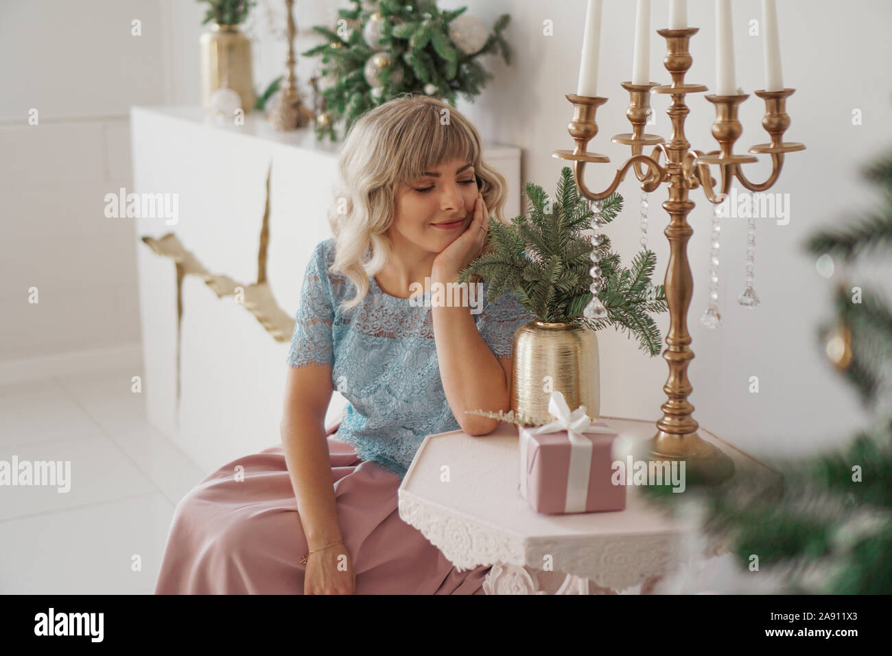 Image of dreaming woman with gift box Stock Photo - Alamy