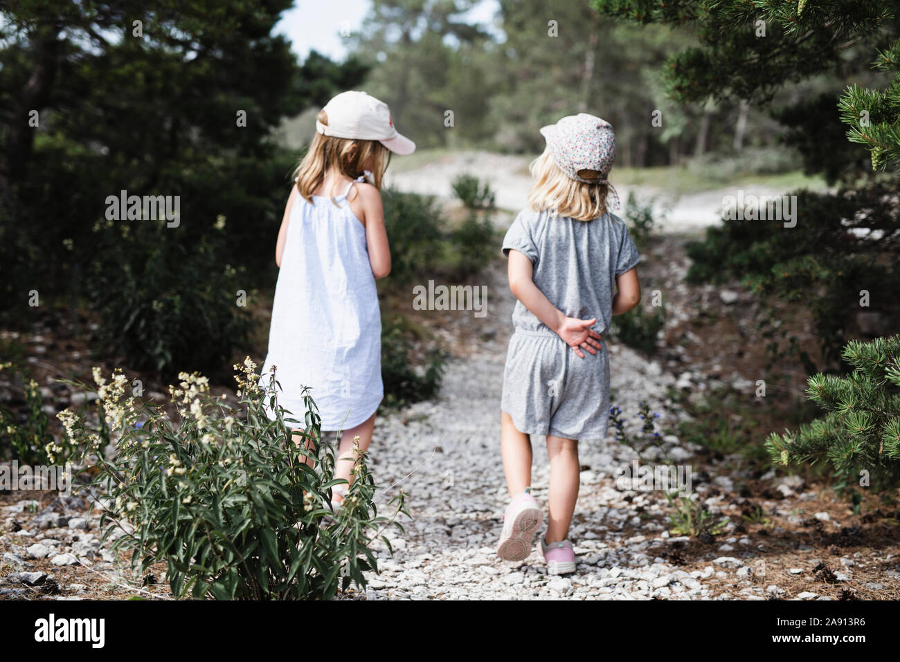 Rear view girls friends walking hi-res stock photography and images - Alamy