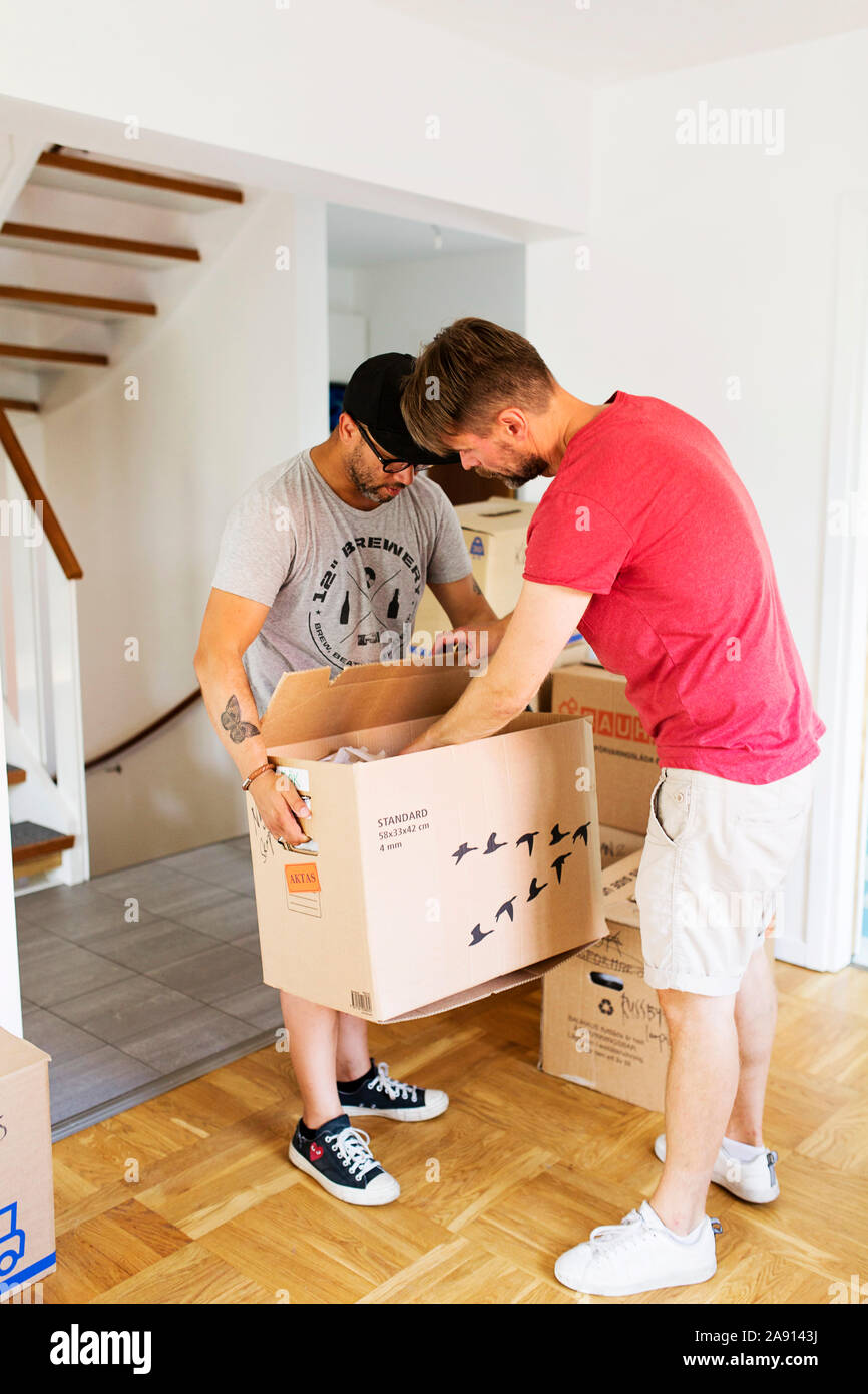 Men moving house Stock Photo - Alamy
