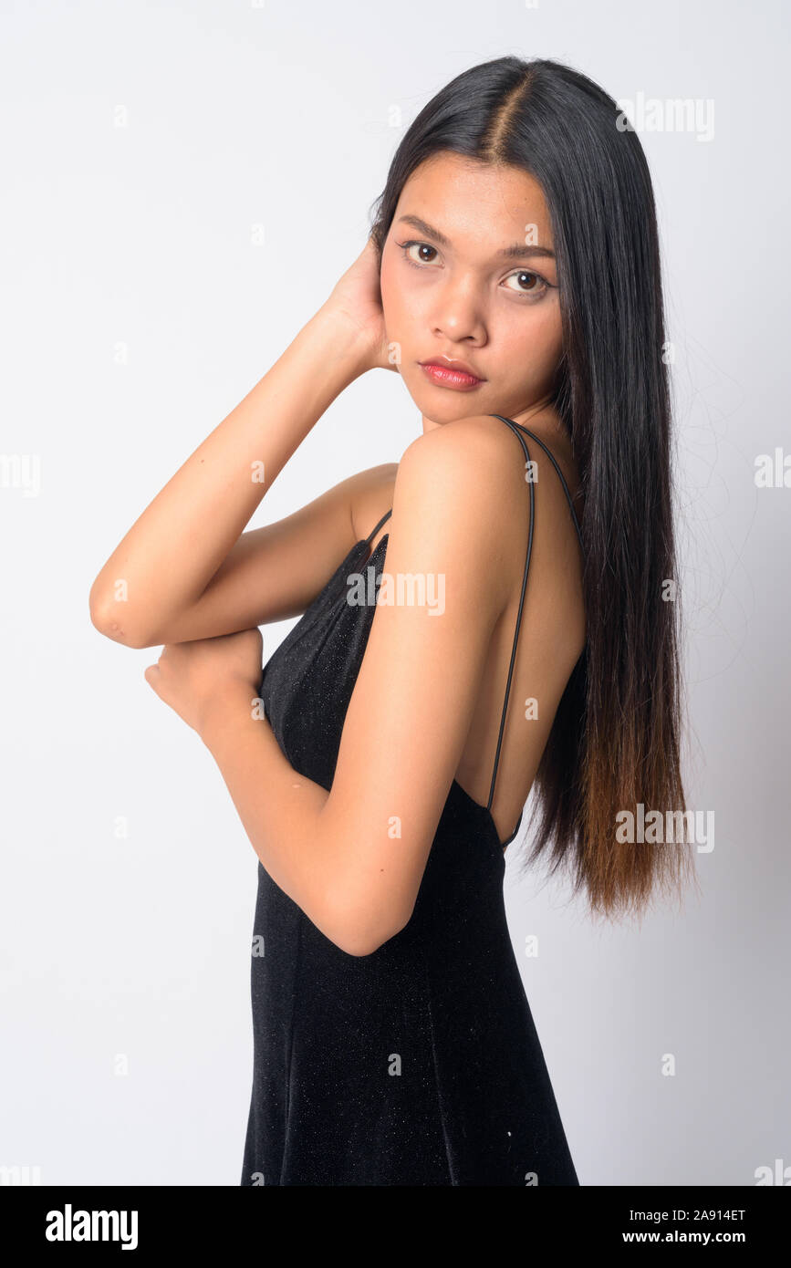Profile view of young beautiful Asian woman Stock Photo - Alamy