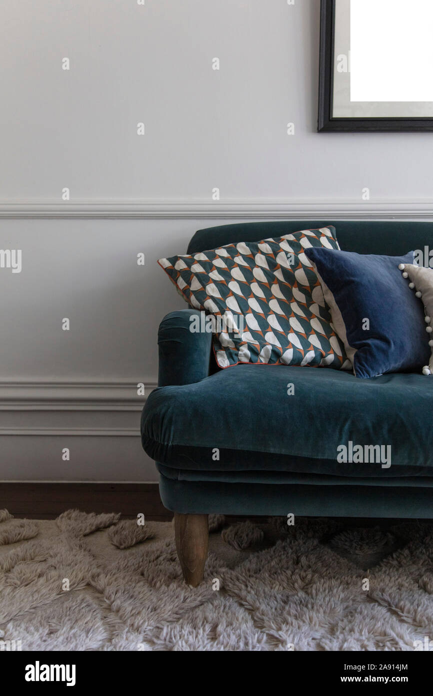 Comfortable blue sofa in a modern fashionable interior designed living ...