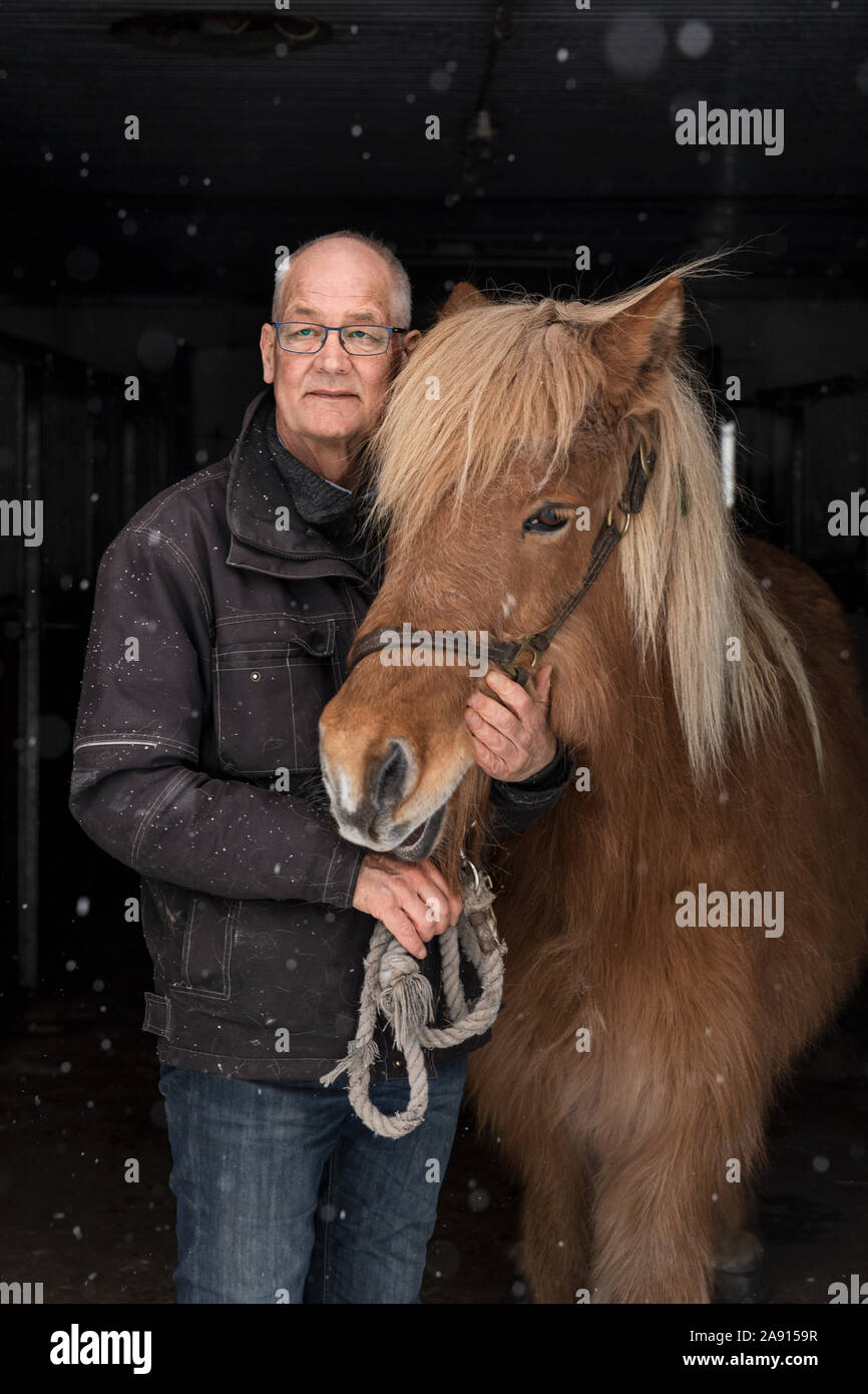 Senior man with pony Stock Photo - Alamy