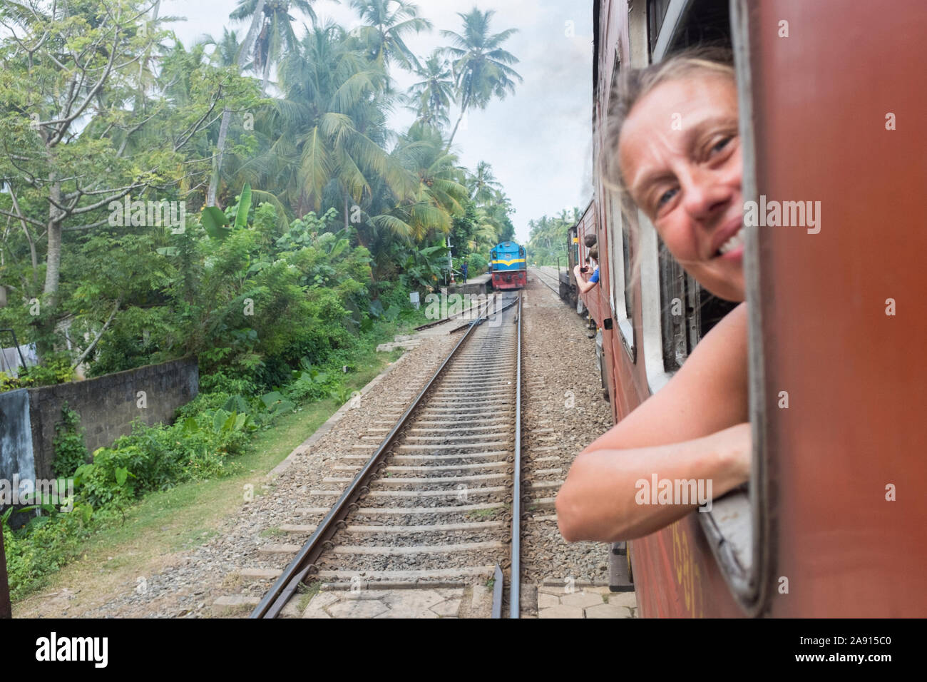 Woman looking through train window Stock Photo - Alamy
