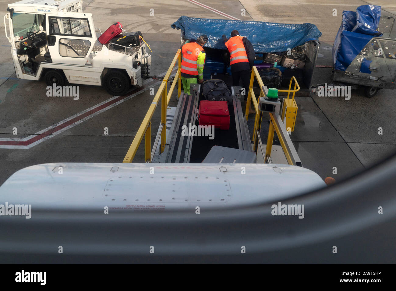 bags trolley luggage loading on airplane Stock Photo - Alamy