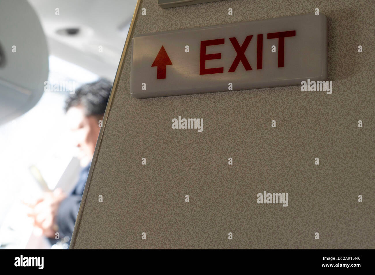exit sign on airplane detail Stock Photo - Alamy