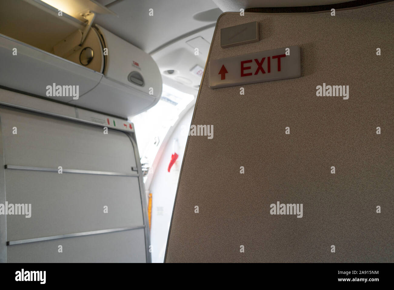 Airplane cabin interior exit sign hi-res stock photography and images ...
