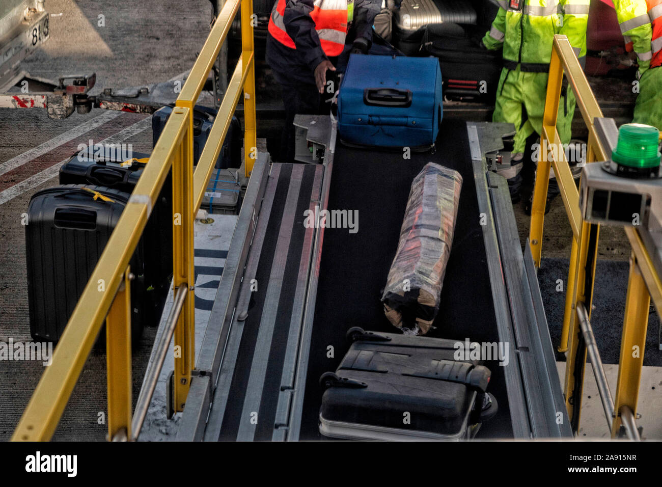 bags trolley luggage loading on airplane Stock Photo - Alamy