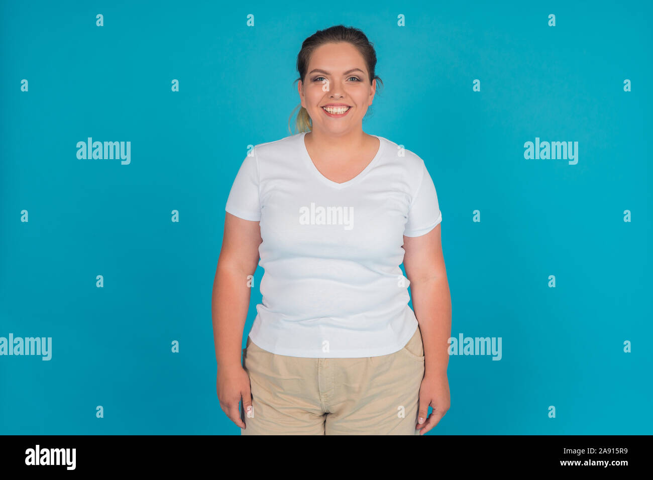 Body positive. Portrait of a smiling girl in size plus Stock Photo - Alamy