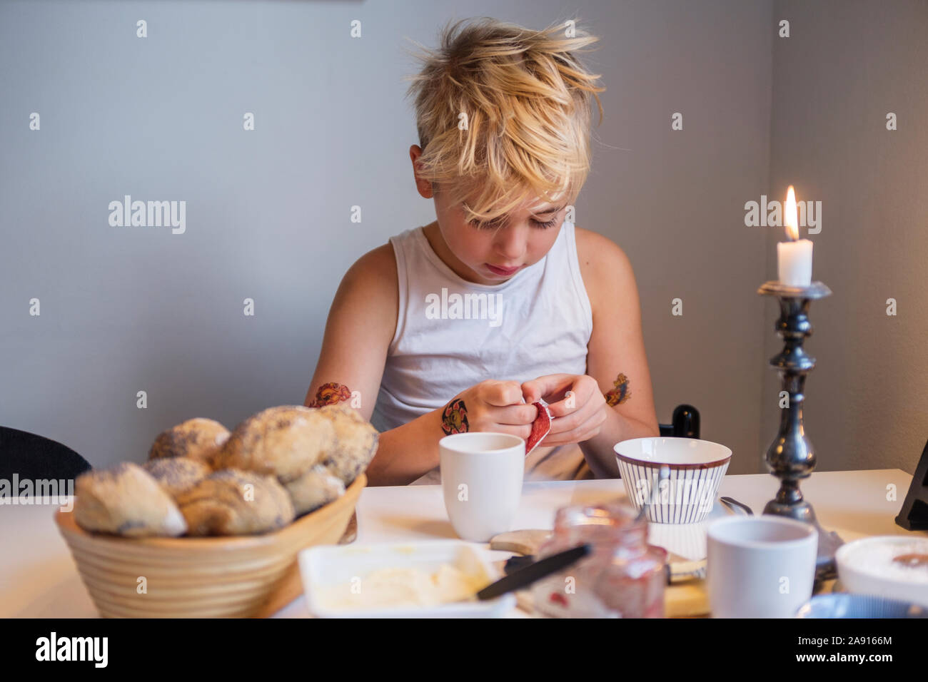 Boy having breakfast Stock Photo - Alamy