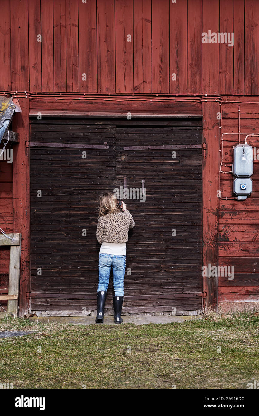 Girl in front of barn Stock Photo - Alamy