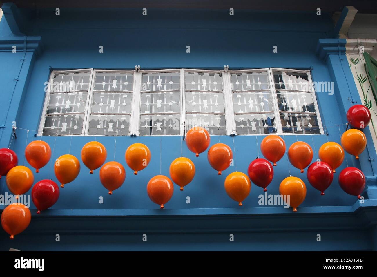 Windows in Singapore Chinetown with ceramics balloons Stock Photo - Alamy