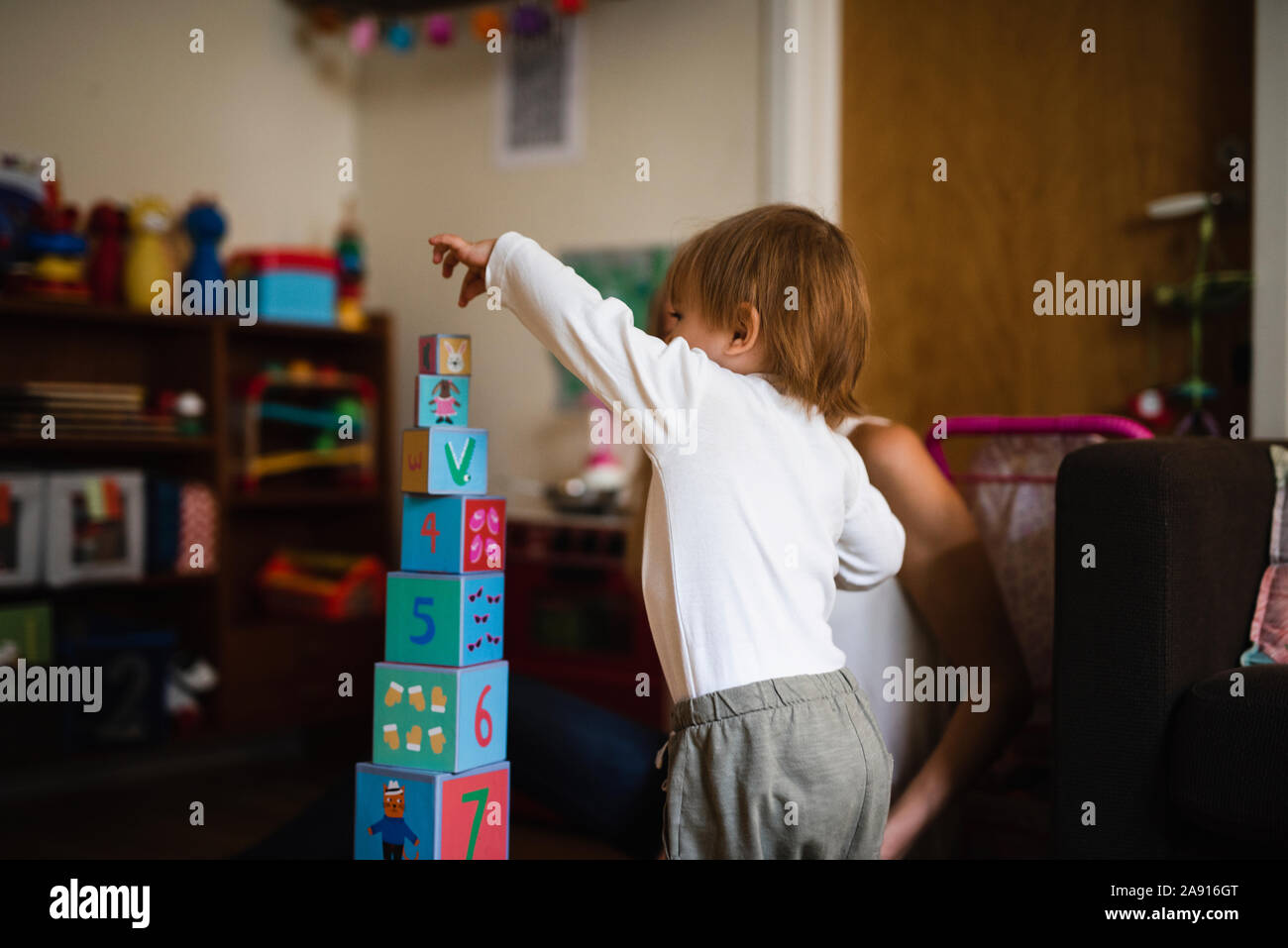 Toddler building block tower Stock Photo - Alamy