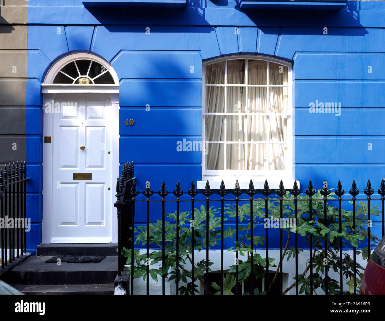 Bright blue terraced Victorian house in London Stock Photo - Alamy