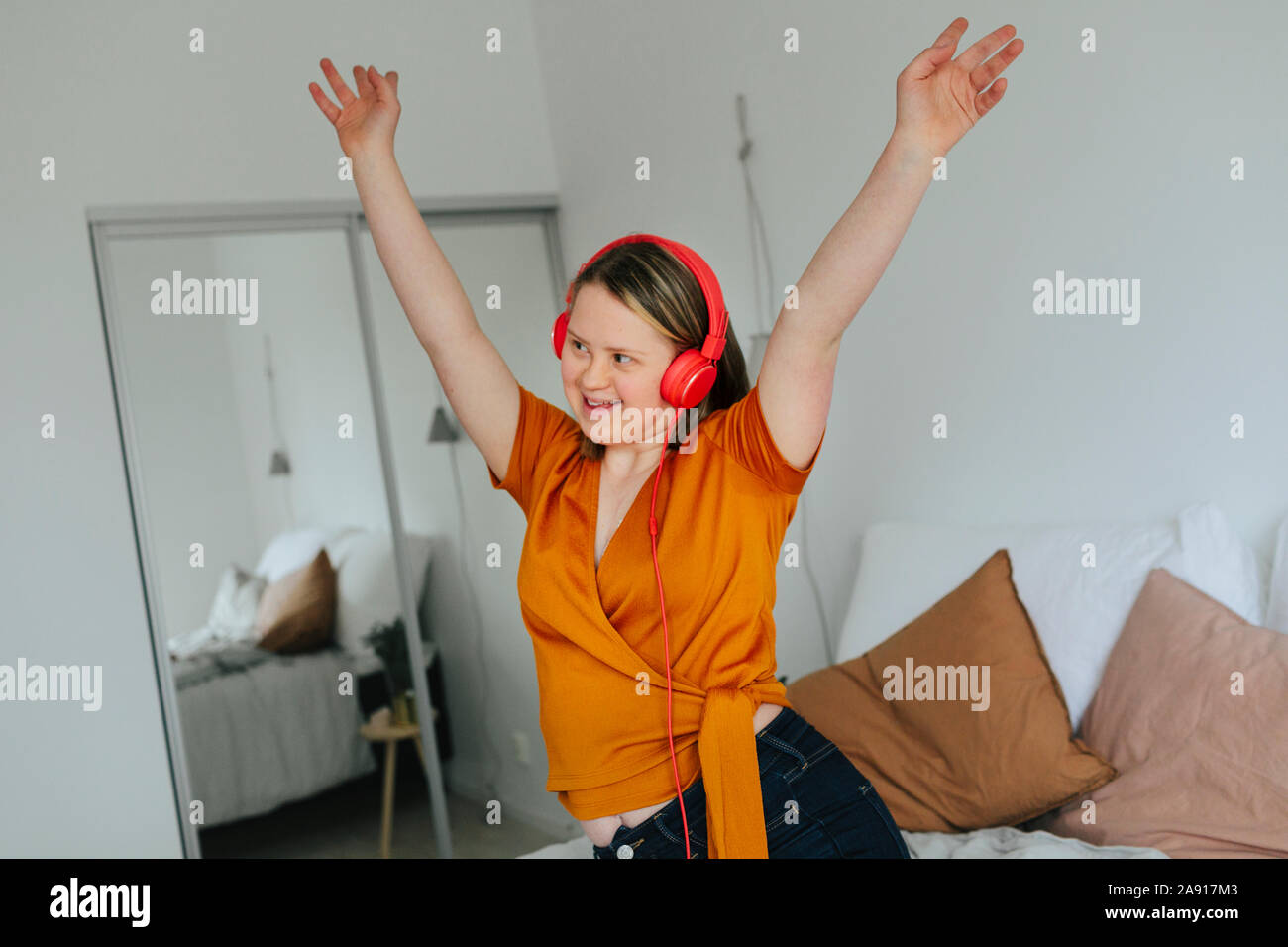 Girl with headphones dancing to music Stock Photo - Alamy
