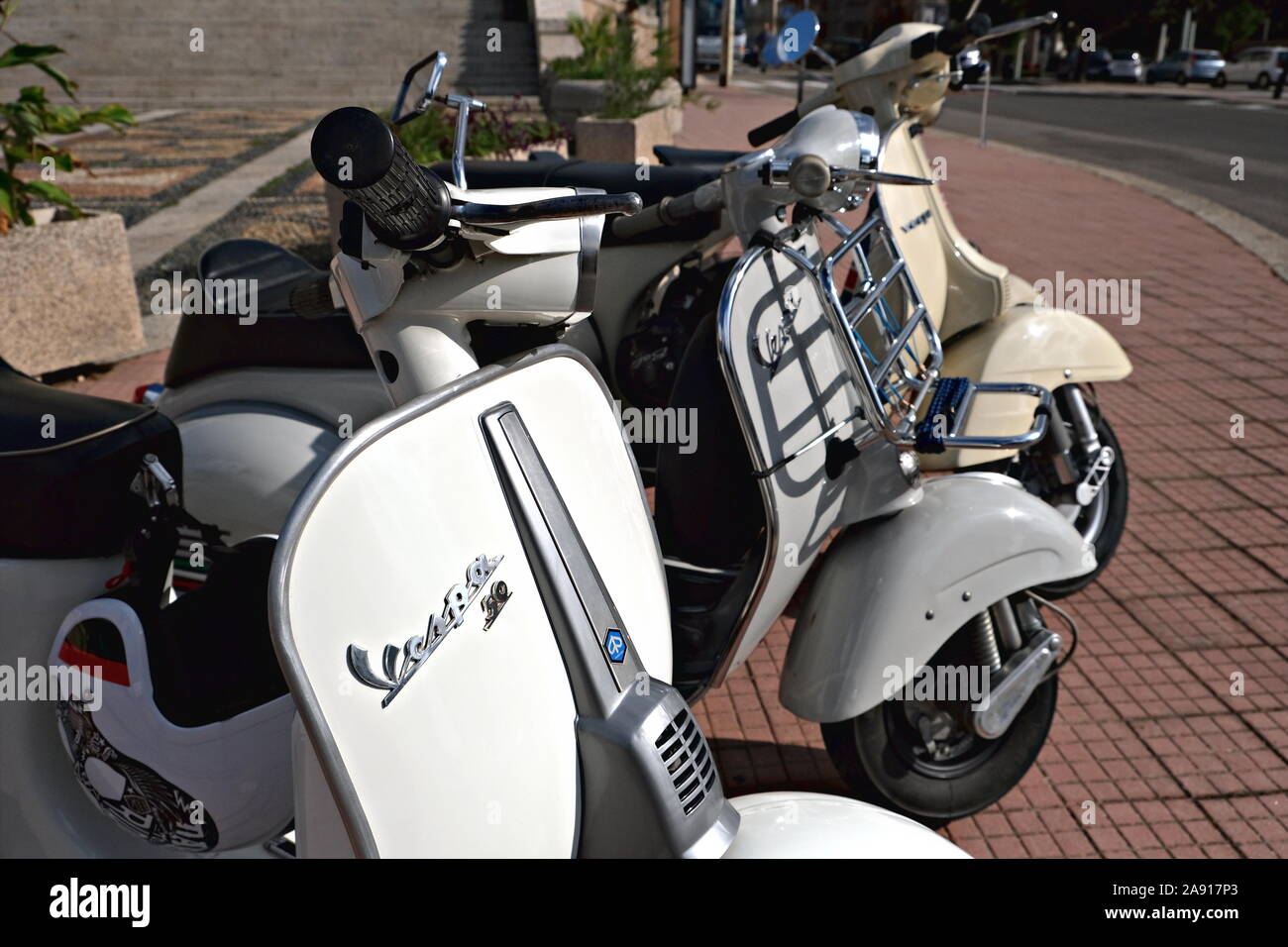 group of old fashioned scooters "Vespa" parked on the street Stock ...