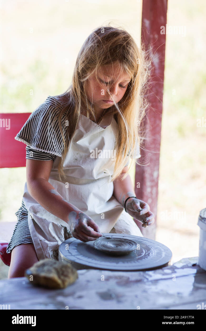Girl making pottery Stock Photo - Alamy