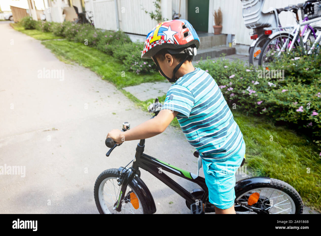 Three boys cycling hi-res stock photography and images - Alamy