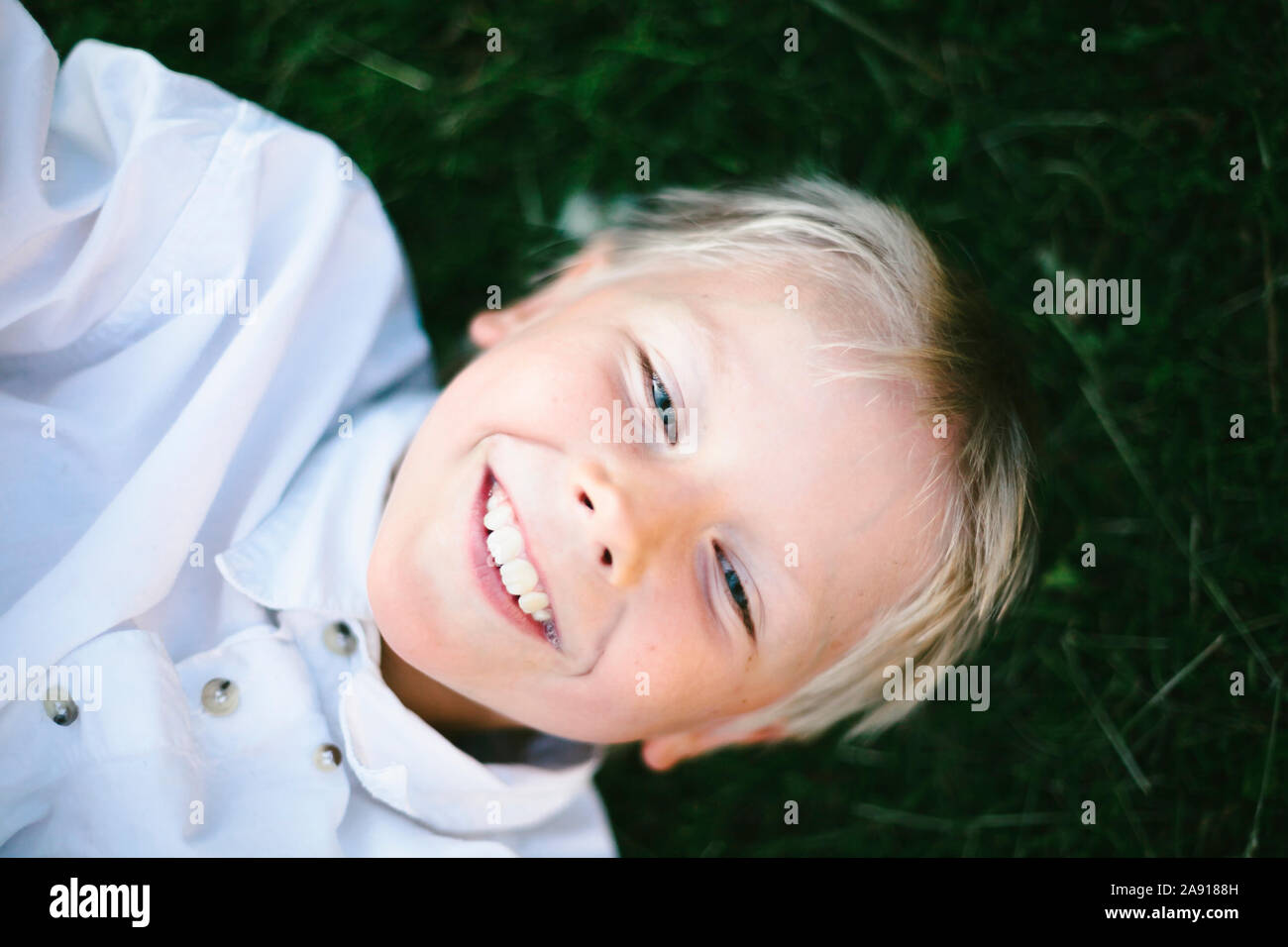 Boy looking at camera Stock Photo - Alamy