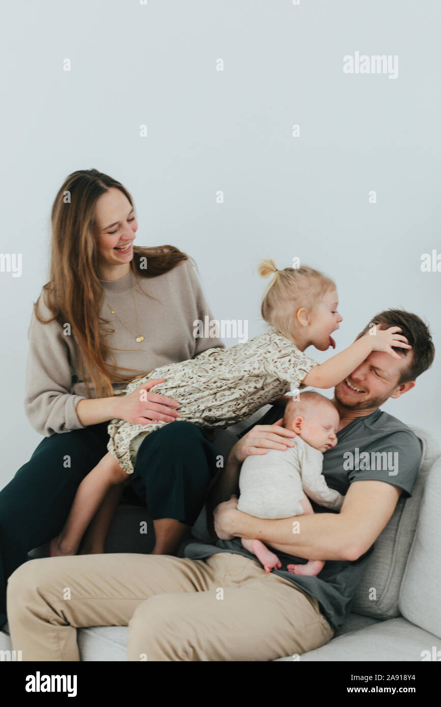 Parents with two children Stock Photo - Alamy