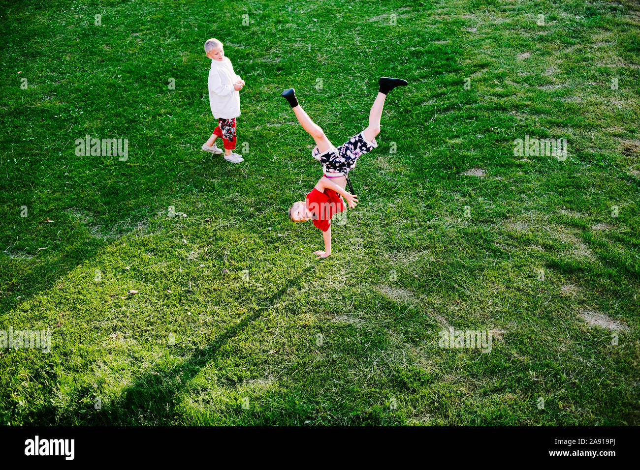 Boy doing handstand Stock Photo - Alamy