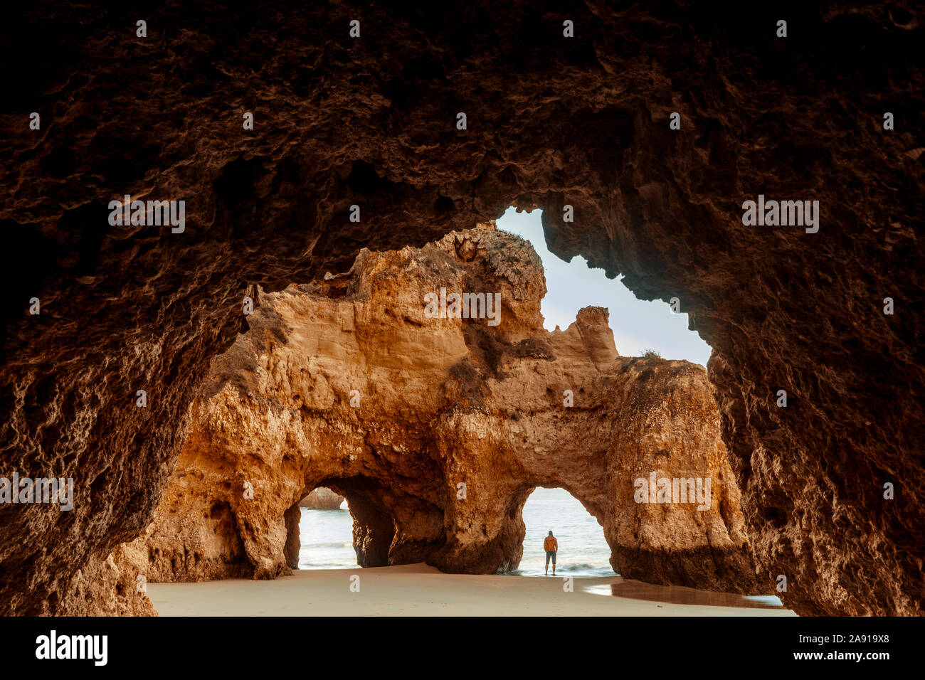 Rock arches on beach Stock Photo - Alamy