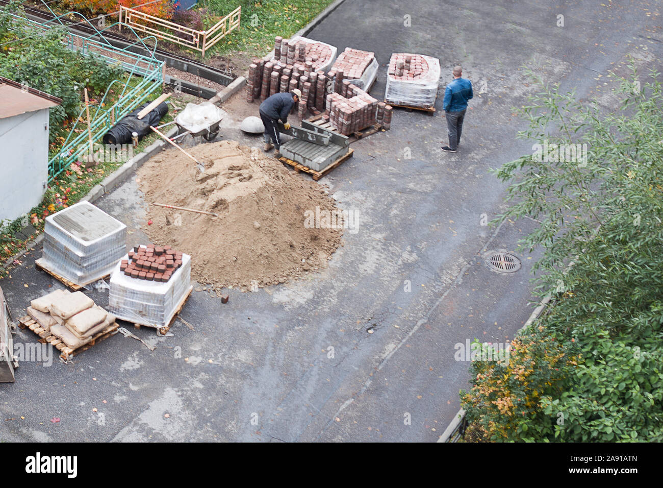 Road workers are building a track. A lot of building materials on the ...