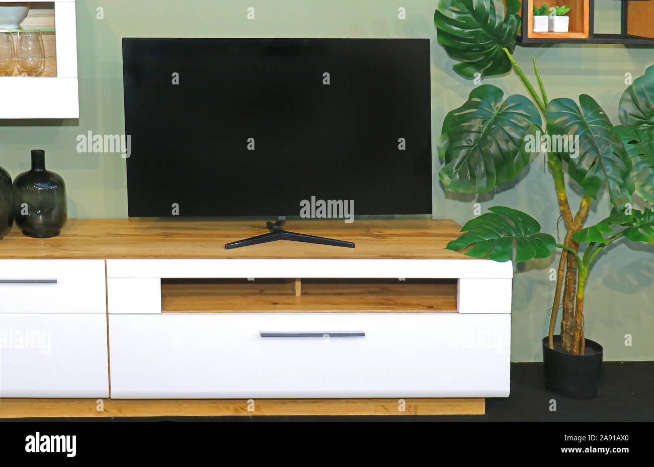 Large television inside living room interior with modern furniture ...