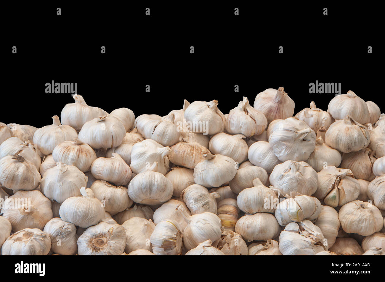 White garlic pile texture isolated on black background, clipping path ...