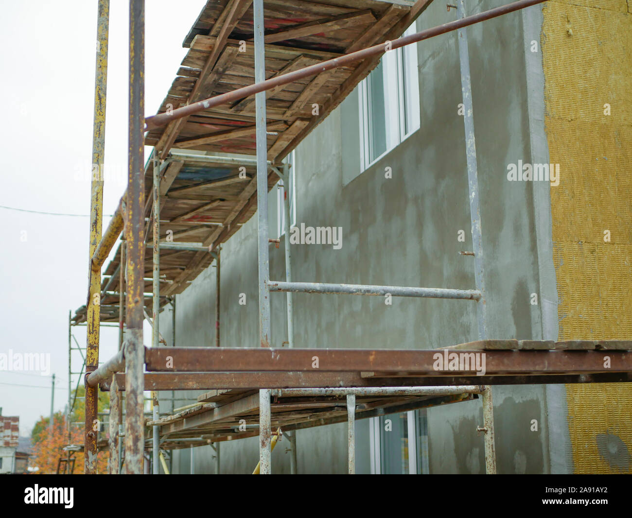 external warming of a private house. Outdoor work. There are rails for ...