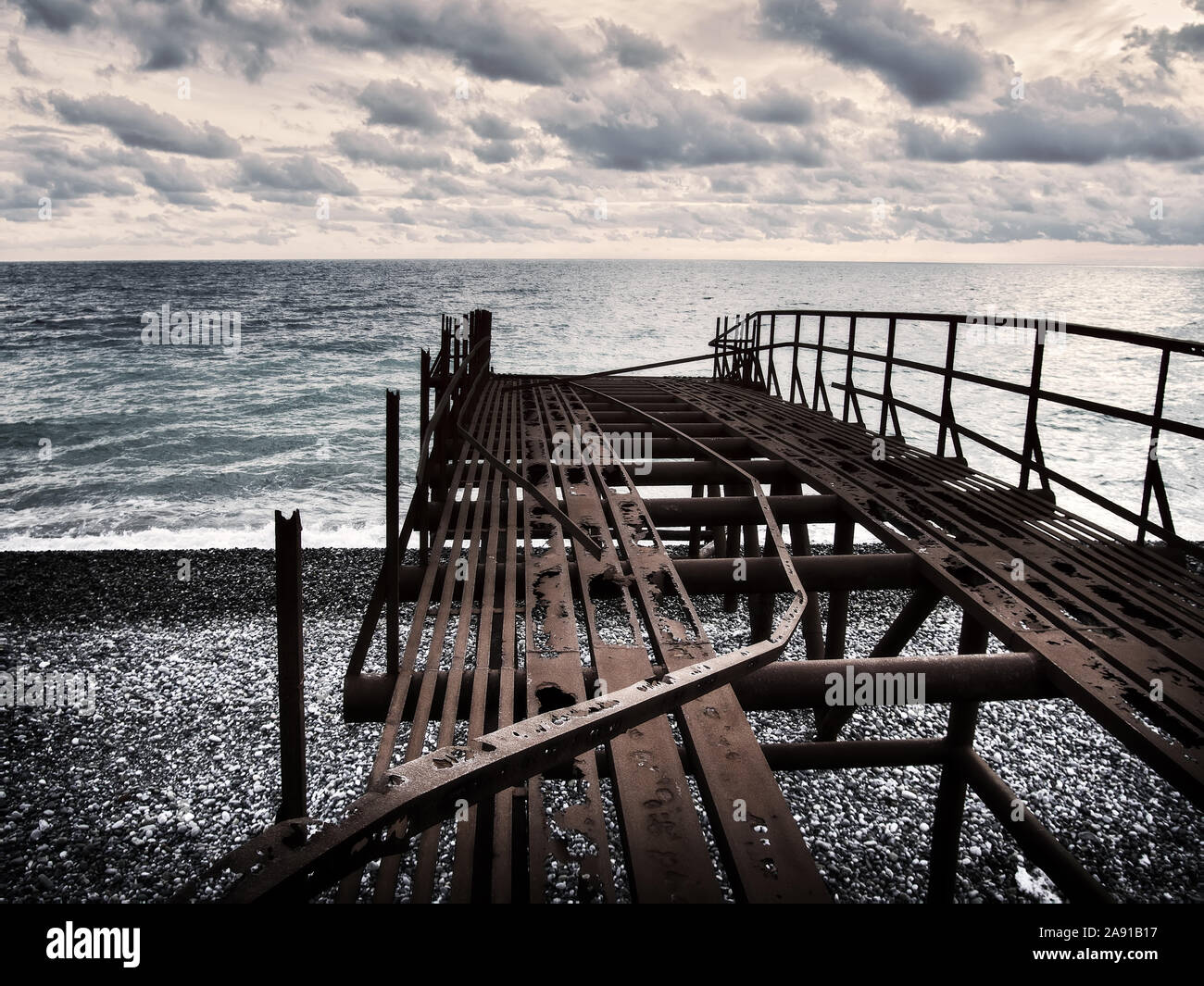 Gloomy rusty sea berth for ships. Metal industrial building in seaport ...