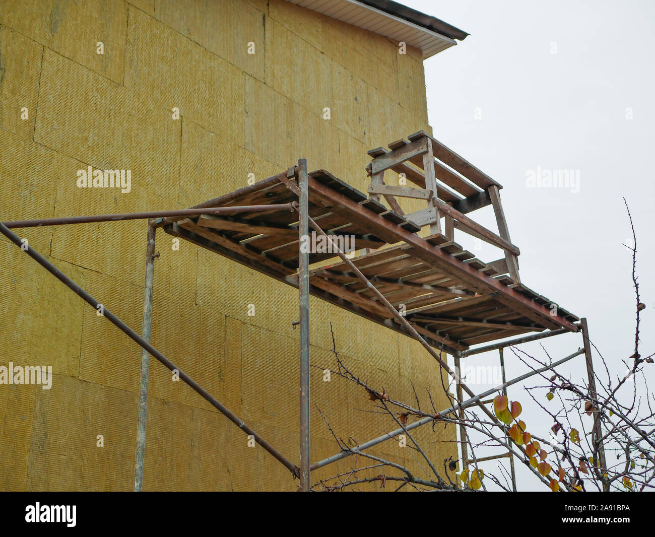 external warming of a private house. Outdoor work. There are rails for ...