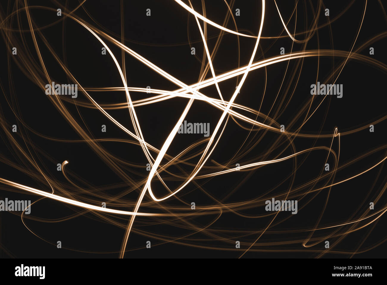 Magic light on black background. Long exposure drawing Stock Photo - Alamy