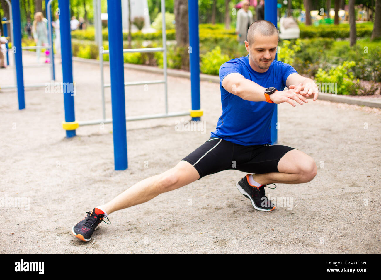 Man doing stretching after hard outdoor workout Stock Photo - Alamy