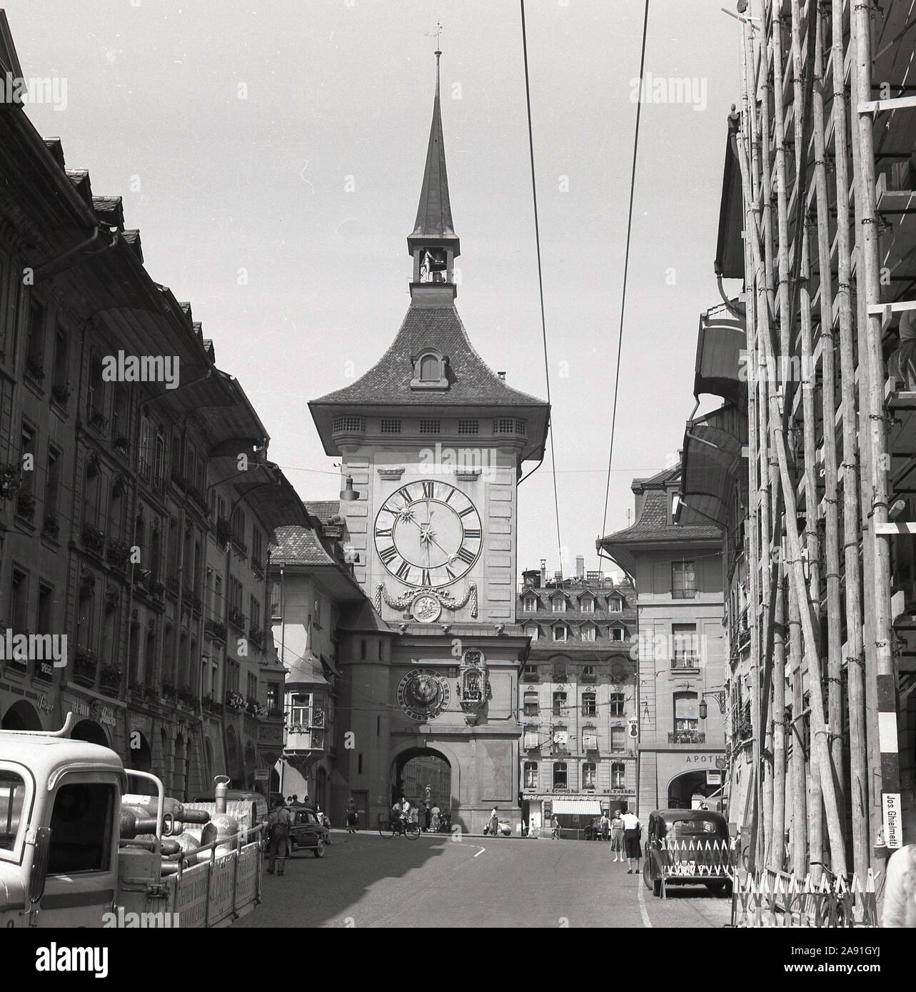 1950s, historical, a cobbled street and surrounding swiss buildings in ...