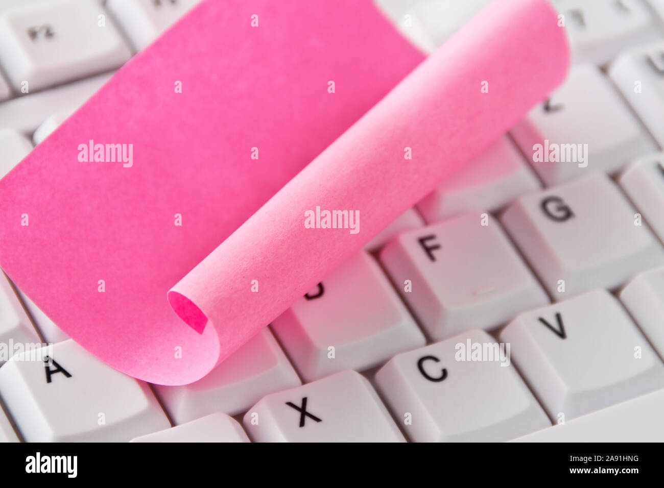 Pink paper and keyboard background Stock Photo - Alamy