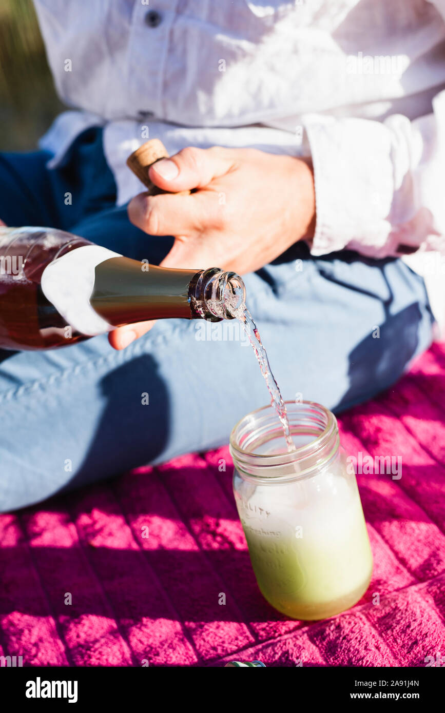 Man pouring champagne Stock Photo - Alamy
