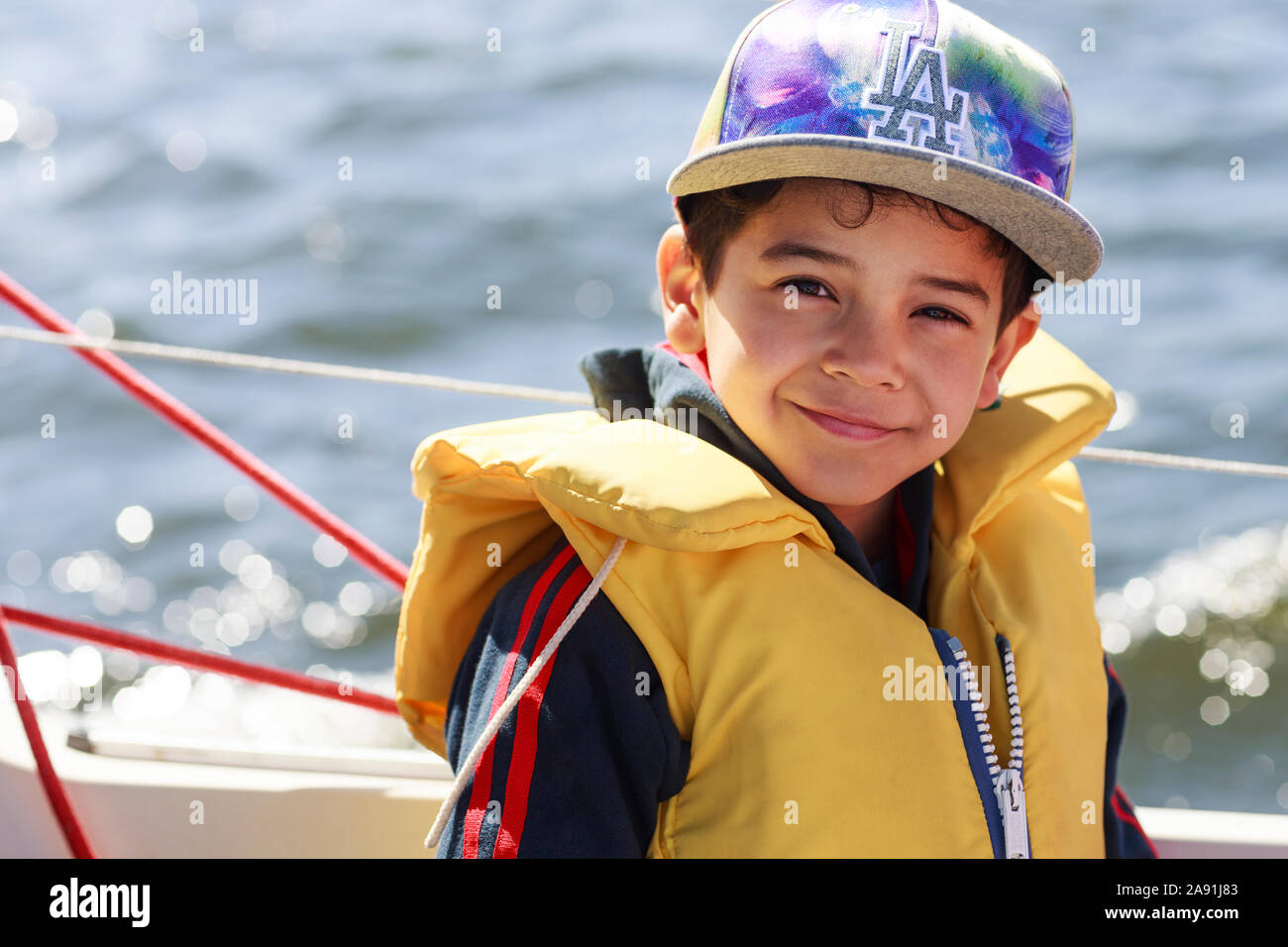 Smiling boy on boat Stock Photo - Alamy