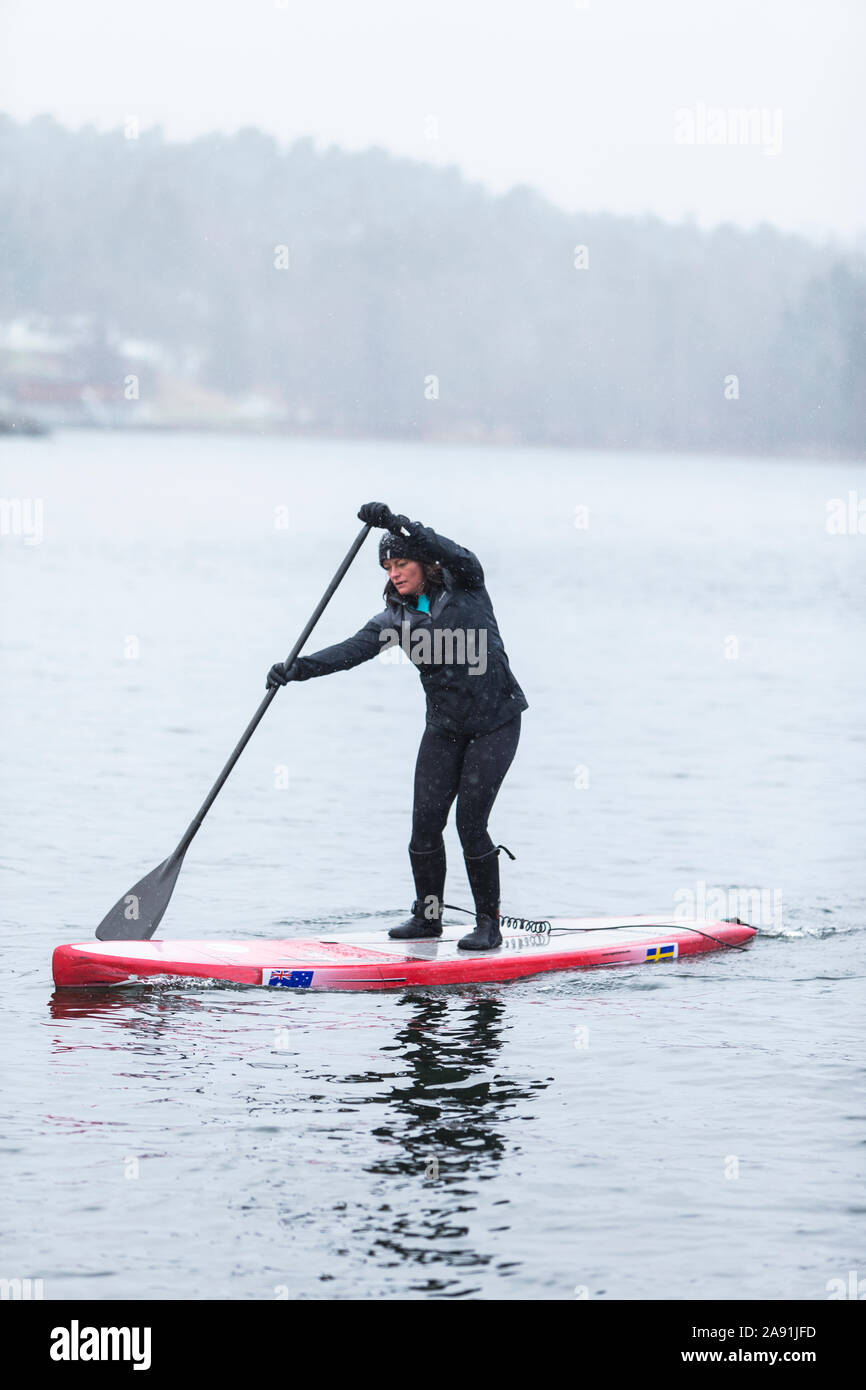 Woman paddle boarding Stock Photo - Alamy