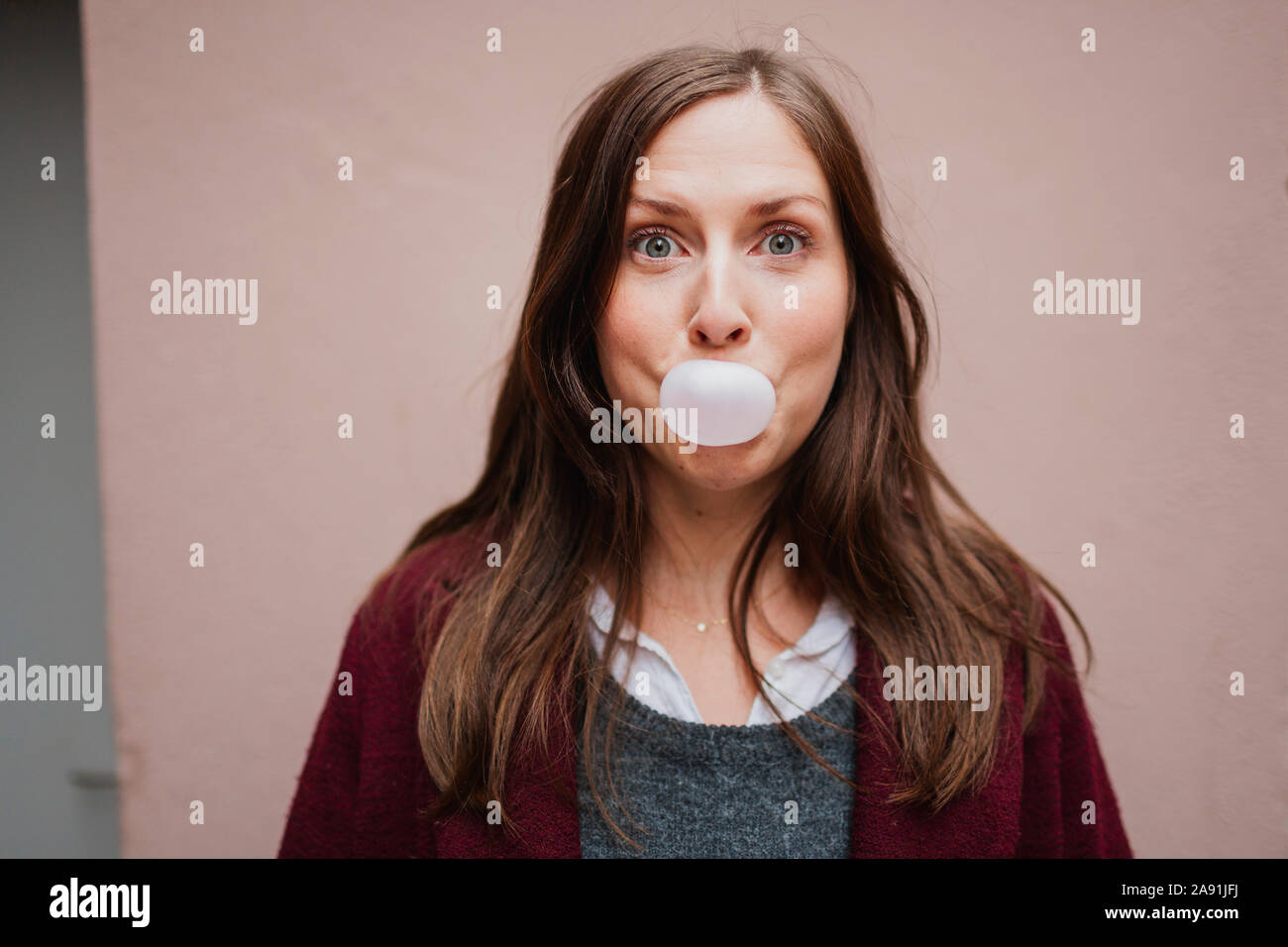 Woman blowing bubble gum hi-res stock photography and images - Alamy