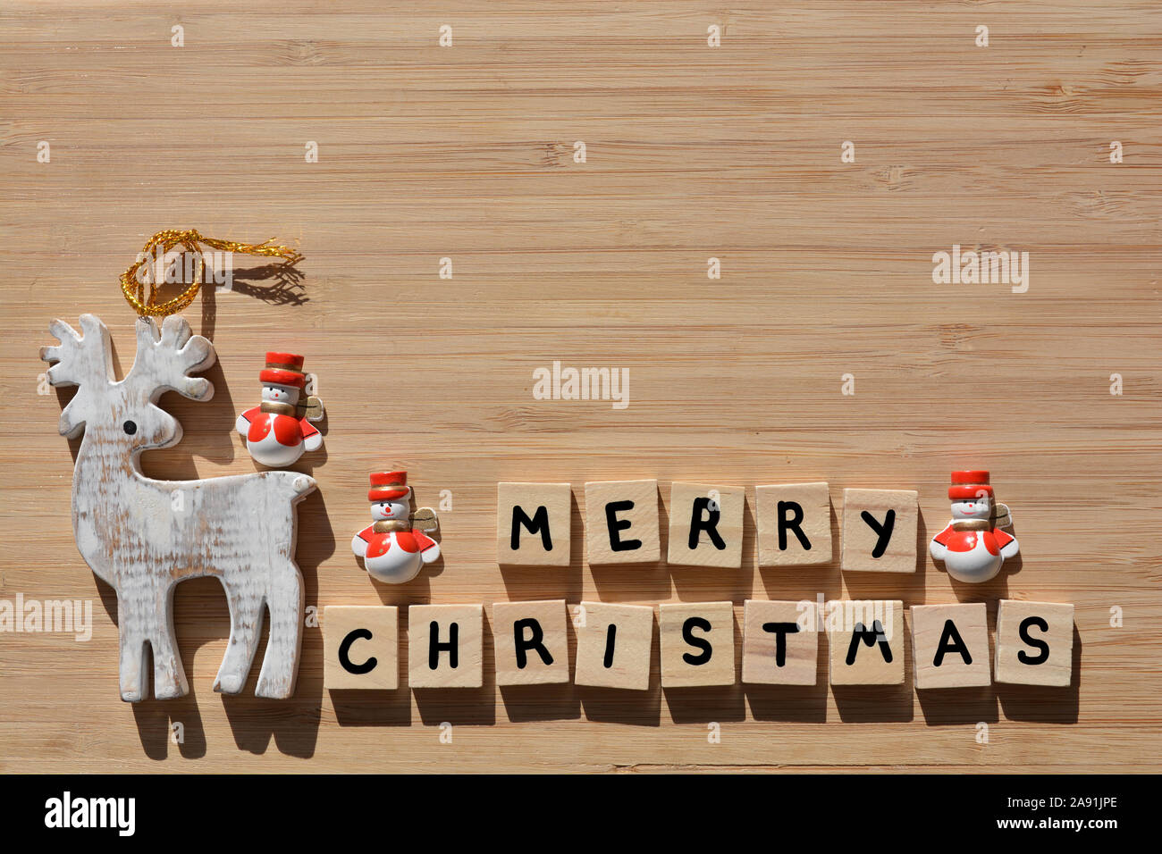 Merry Christmas in 3D wooden alphabet letters with Santa snowmen and a ...