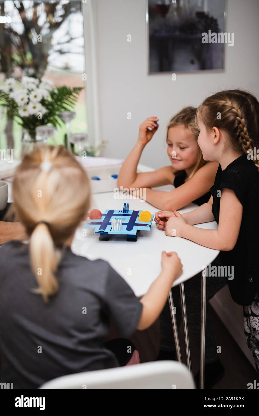 Girl playing board game Stock Photo - Alamy
