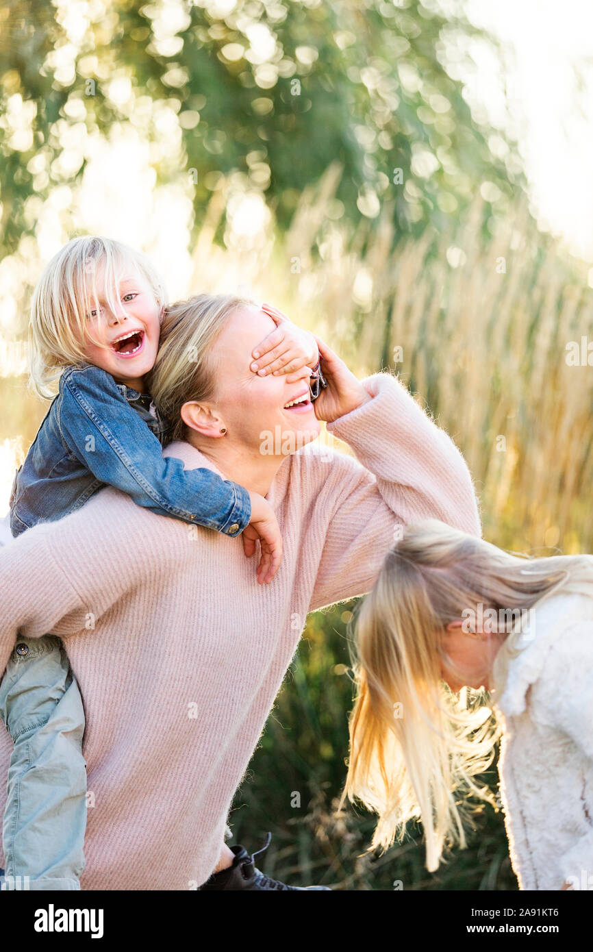 Happy mother with kids Stock Photo - Alamy