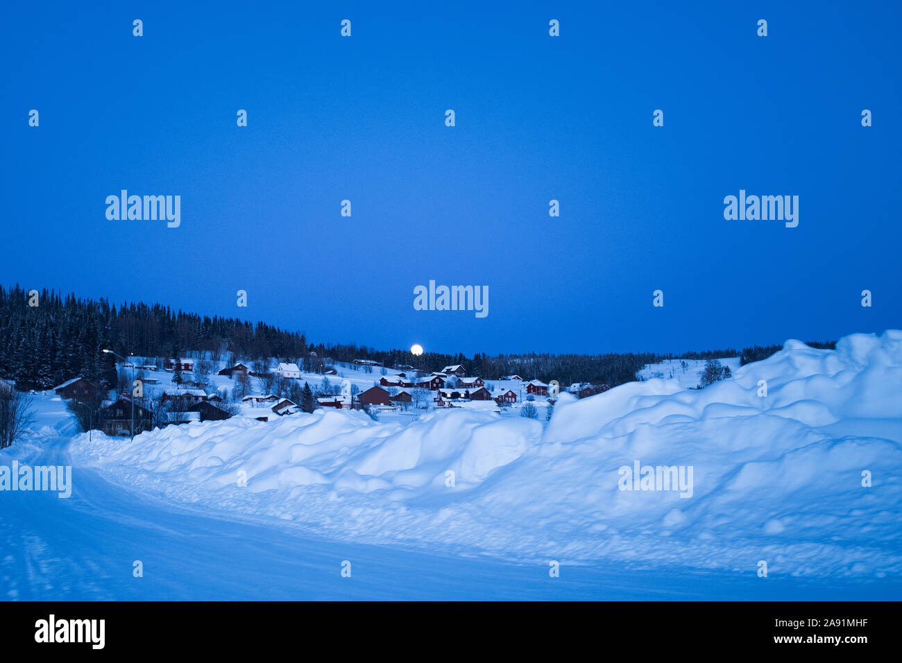 Winter landscape with raising moon Stock Photo - Alamy