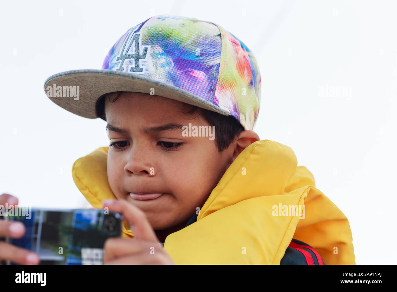 Boy taking picture with cell phone Stock Photo - Alamy