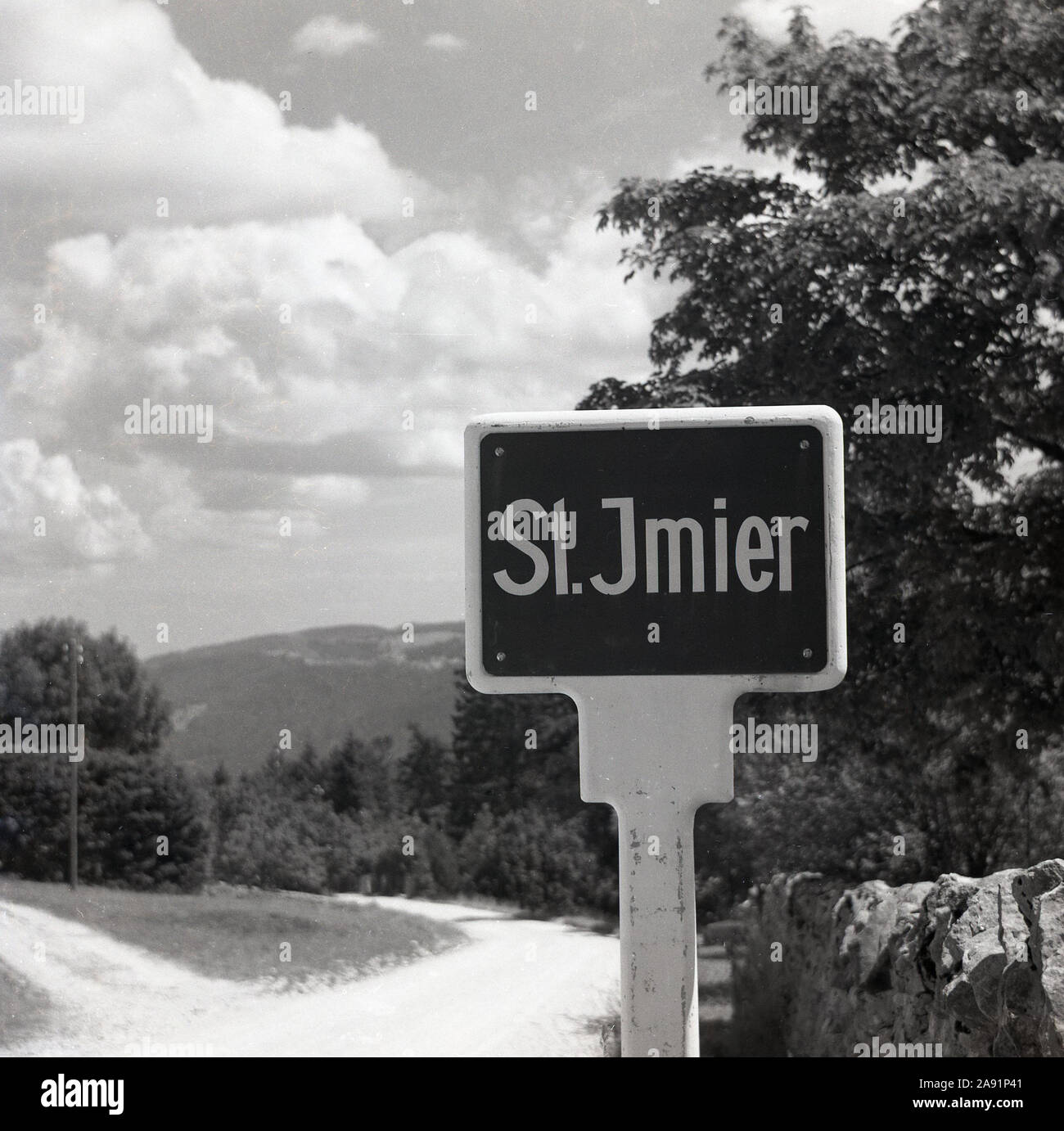 1950s, historical, summertime and a signpost for St Imier, Switzerland ...